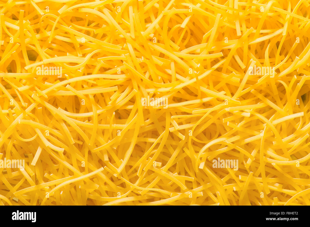 Extreme close up of yellow italian pasta Stock Photo - Alamy