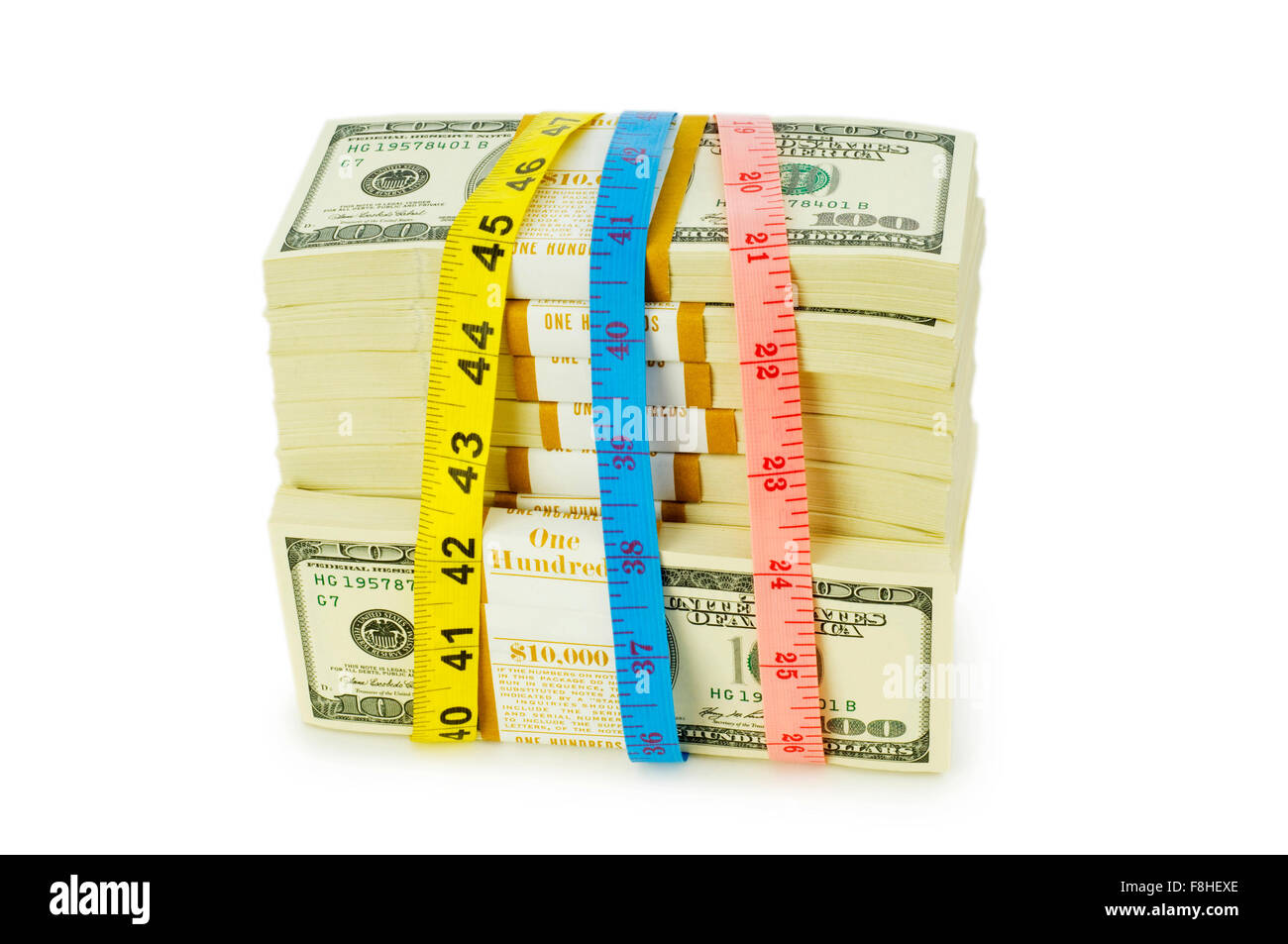 Financial concept - measuring money isolated on white Stock Photo - Alamy