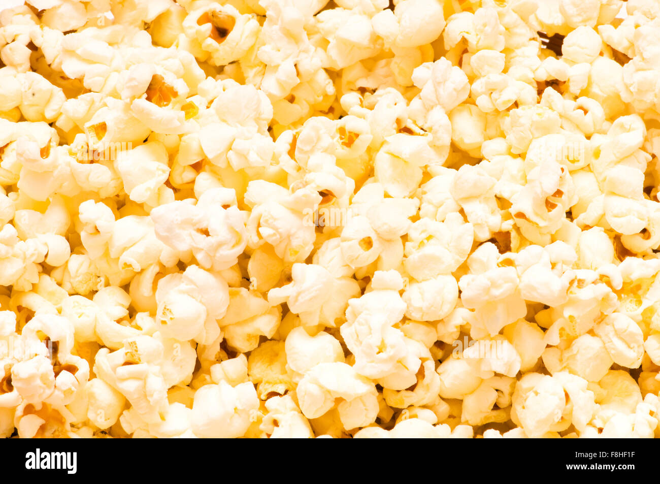 Close up of background - popcorn kernels Stock Photo - Alamy