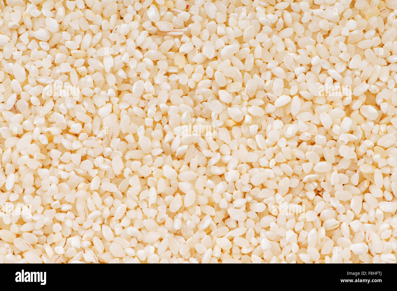 Extreme close up of white rice background Stock Photo - Alamy