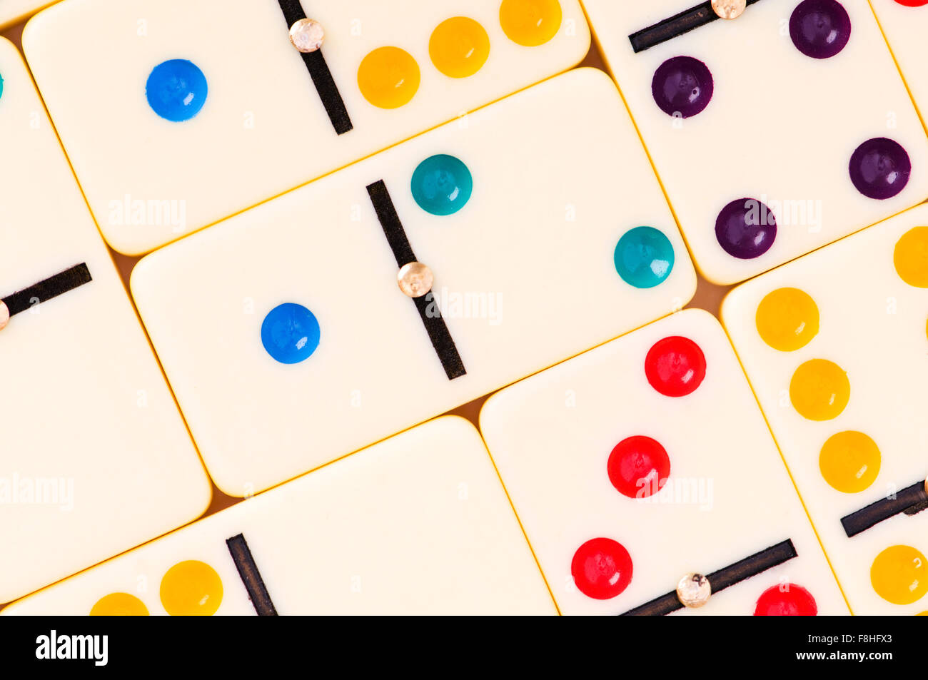 Colourful dominoes arranged at the background Stock Photo - Alamy