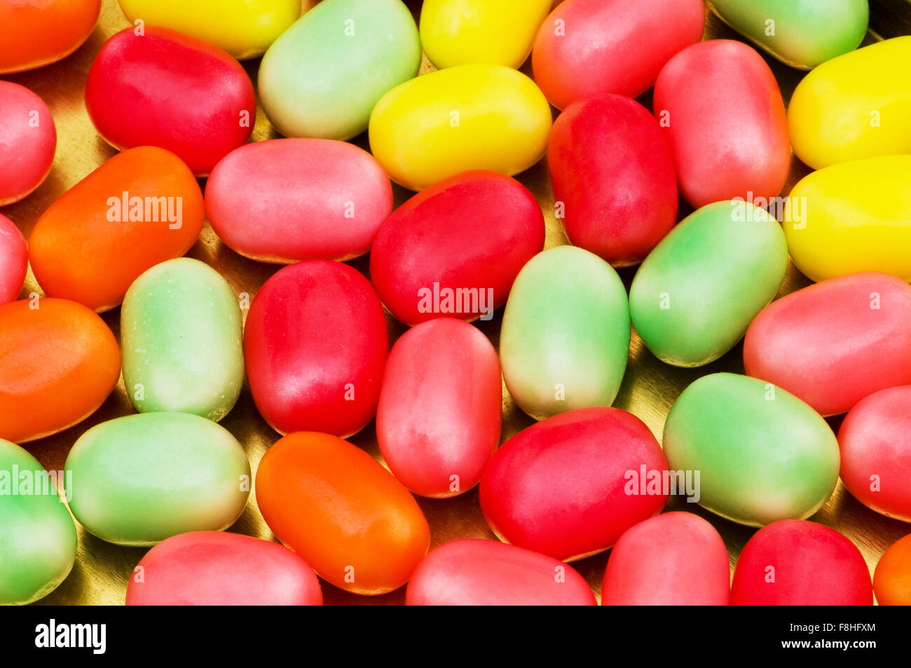 Various dry colourful sweets arranged as background Stock Photo - Alamy