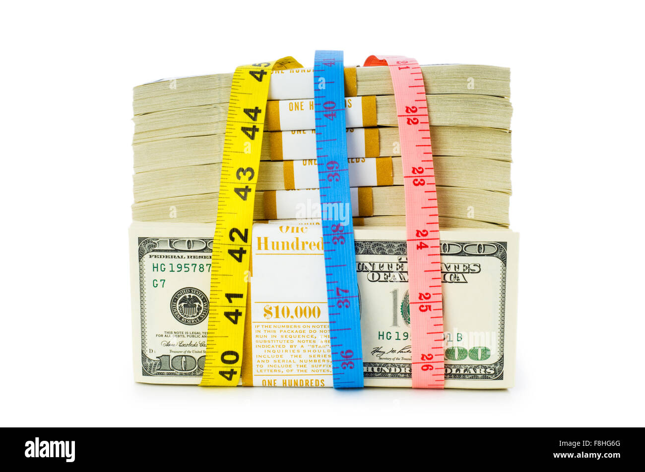 Financial concept - measuring money isolated on white Stock Photo - Alamy