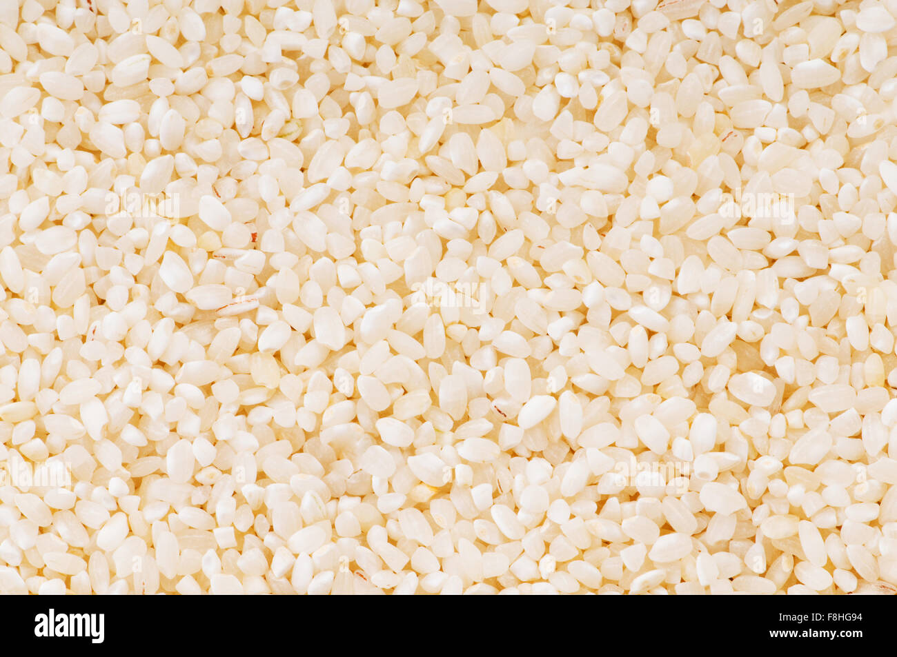 Extreme close up of white rice background Stock Photo - Alamy