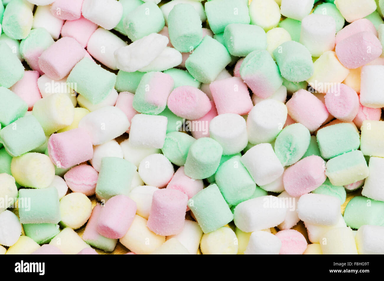 Various dry colourful sweets arranged as background Stock Photo - Alamy