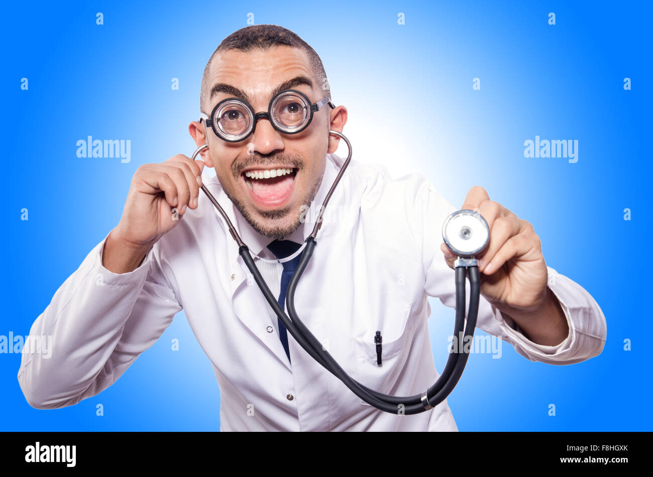 Funny doctor isolated on the white Stock Photo - Alamy