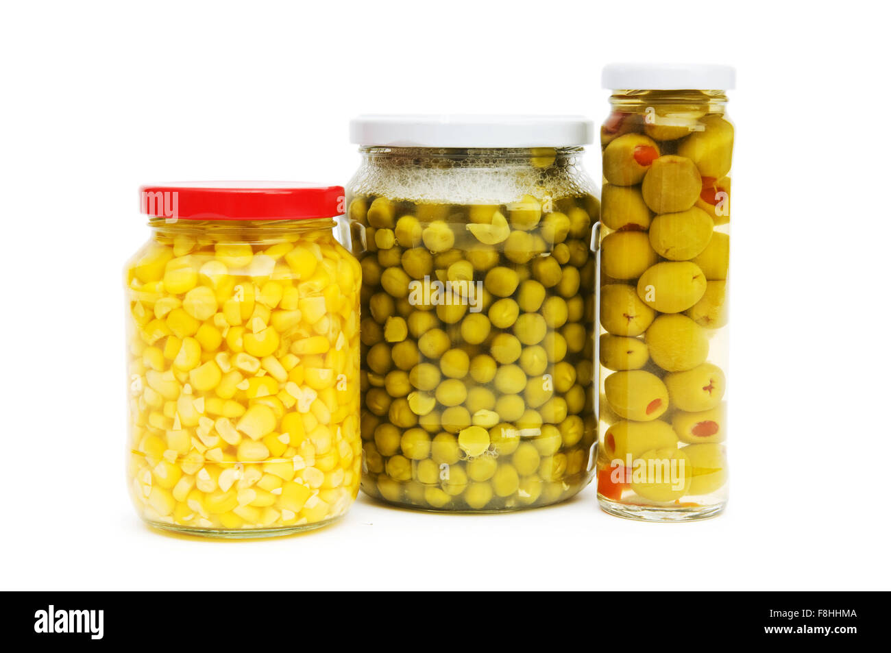 Various pickles in the glass jars on white Stock Photo - Alamy
