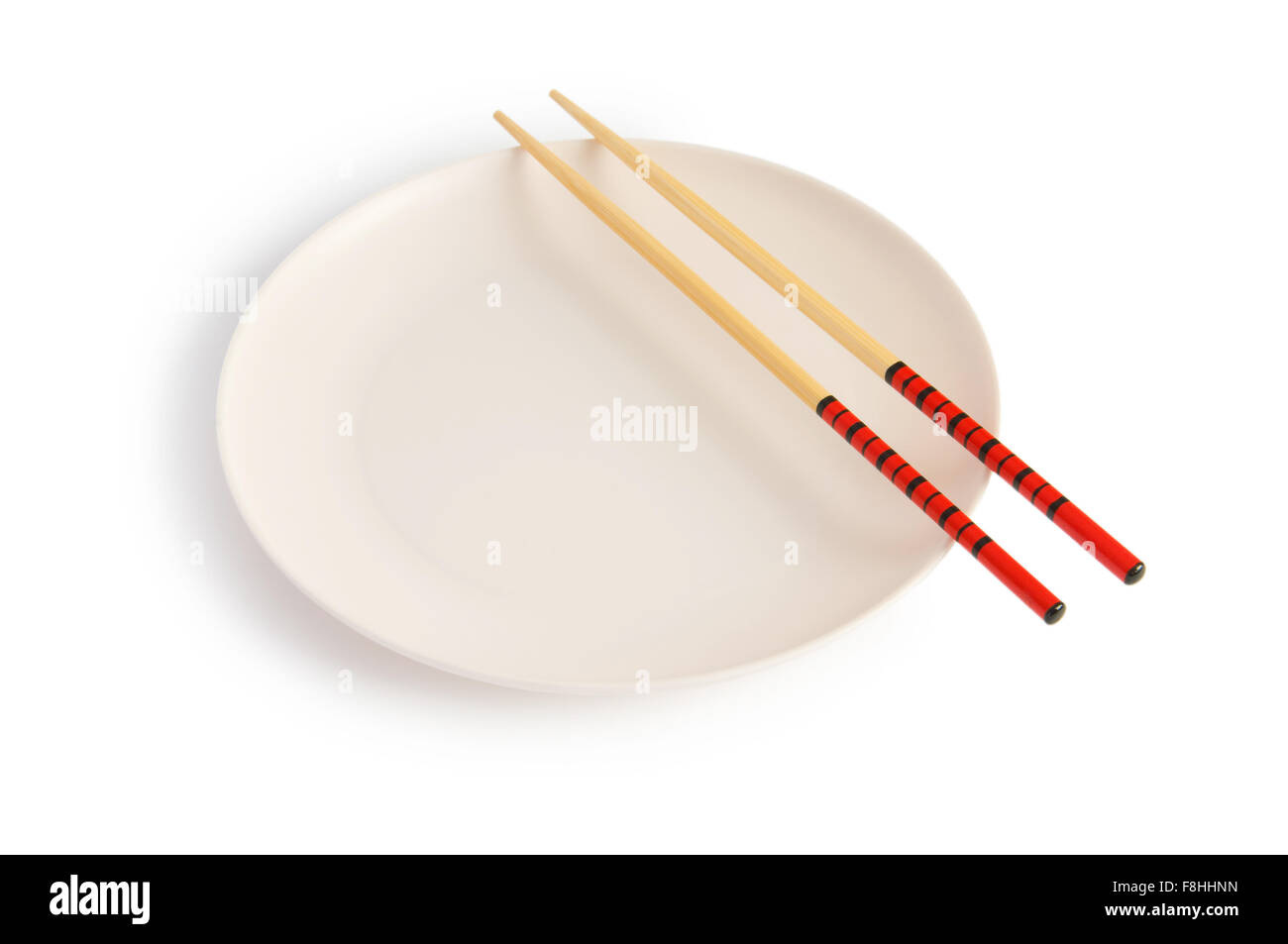 Asian food concept with plate and chopsticks Stock Photo - Alamy