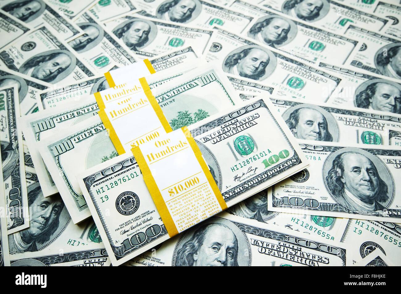 Stack of dollars on money background Stock Photo - Alamy