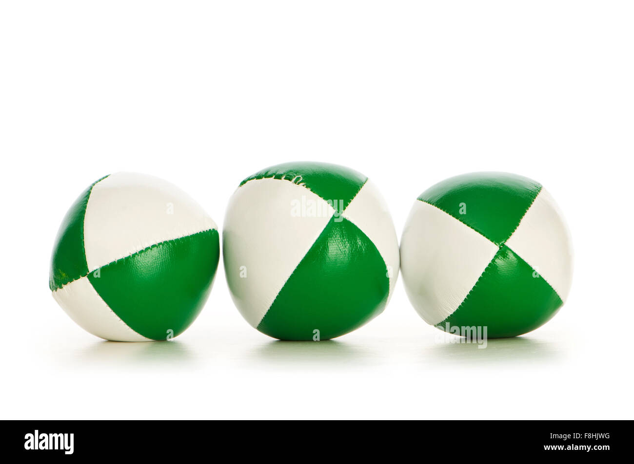 Green stress balls isolated on the white Stock Photo - Alamy