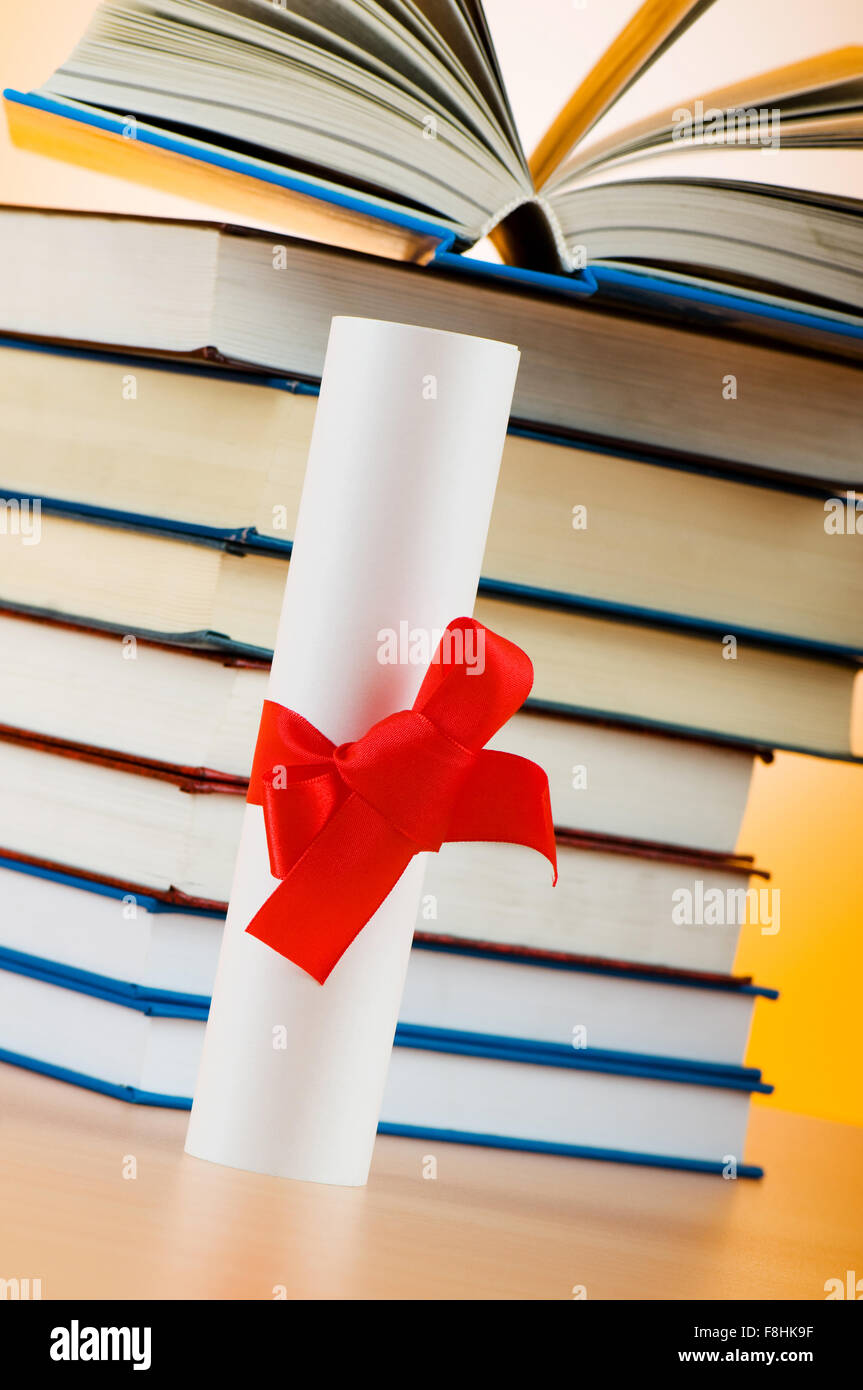 Diploma and stack of books against the background Stock Photo - Alamy