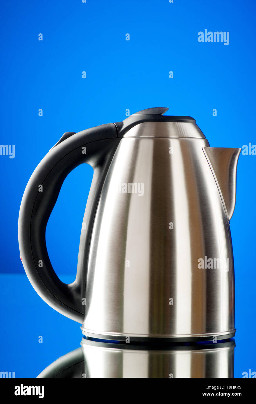Shiny kettle against the colorful gradient background Stock Photo - Alamy