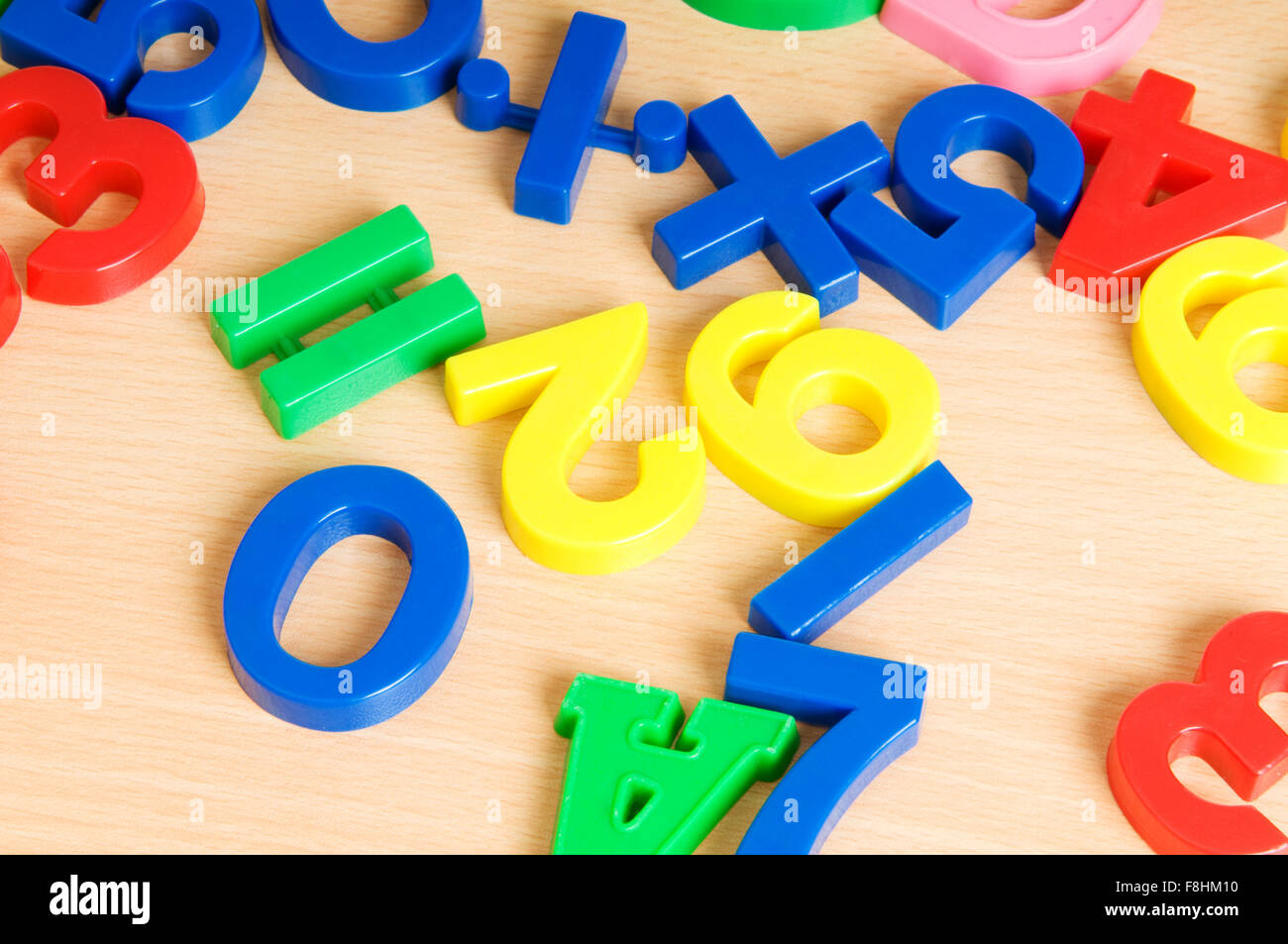 Children letters and digits on the table Stock Photo - Alamy