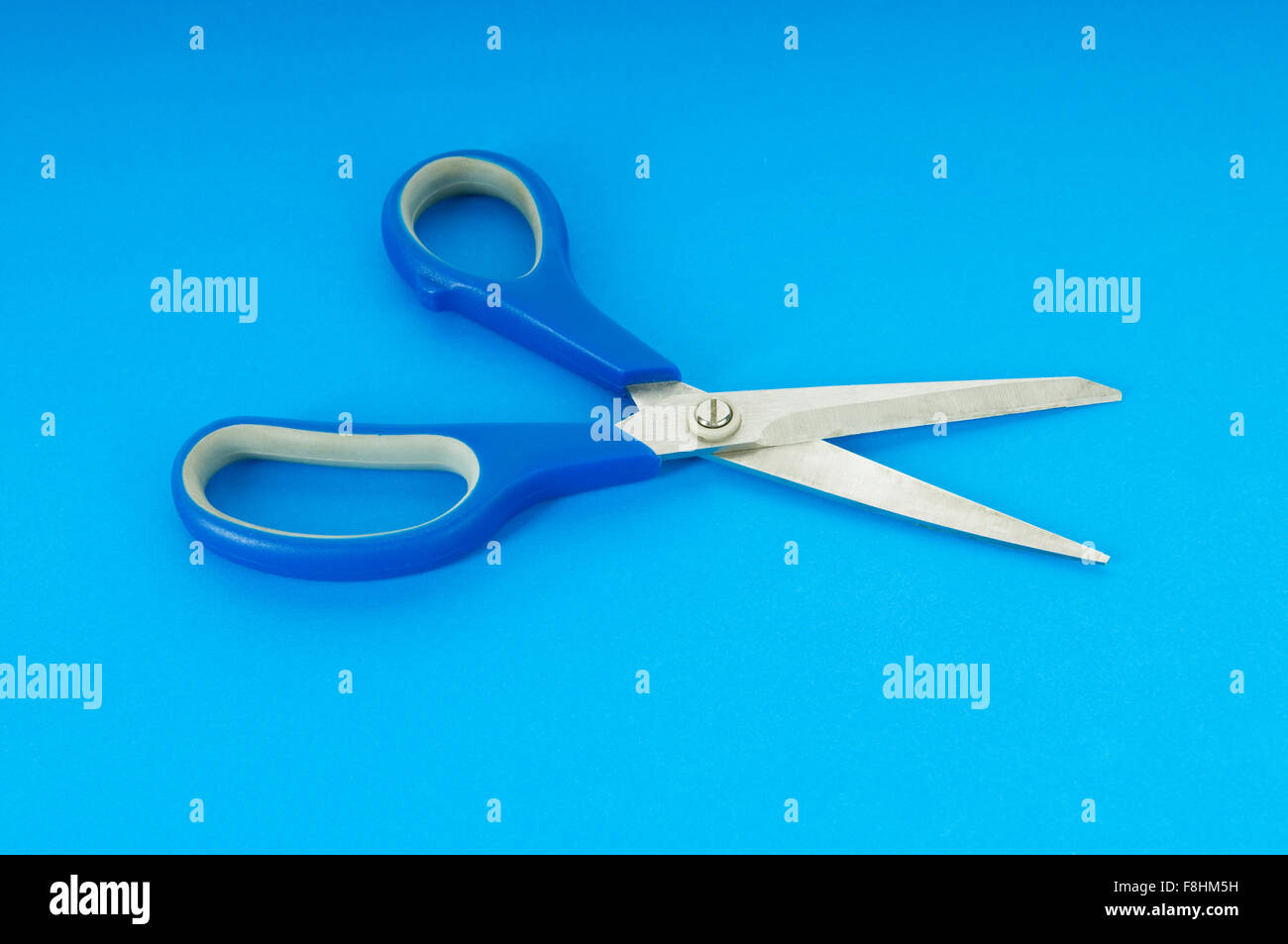 Colorful scissors on the color paper background Stock Photo - Alamy