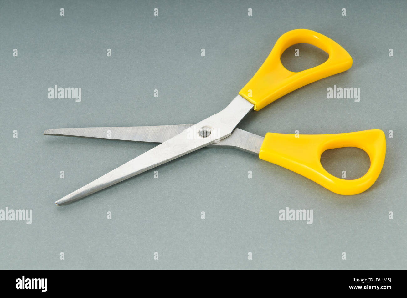 Colorful scissors on the color paper background Stock Photo - Alamy