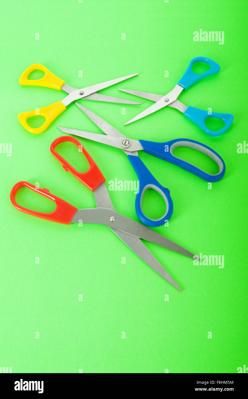 Colorful scissors on the color paper background Stock Photo - Alamy