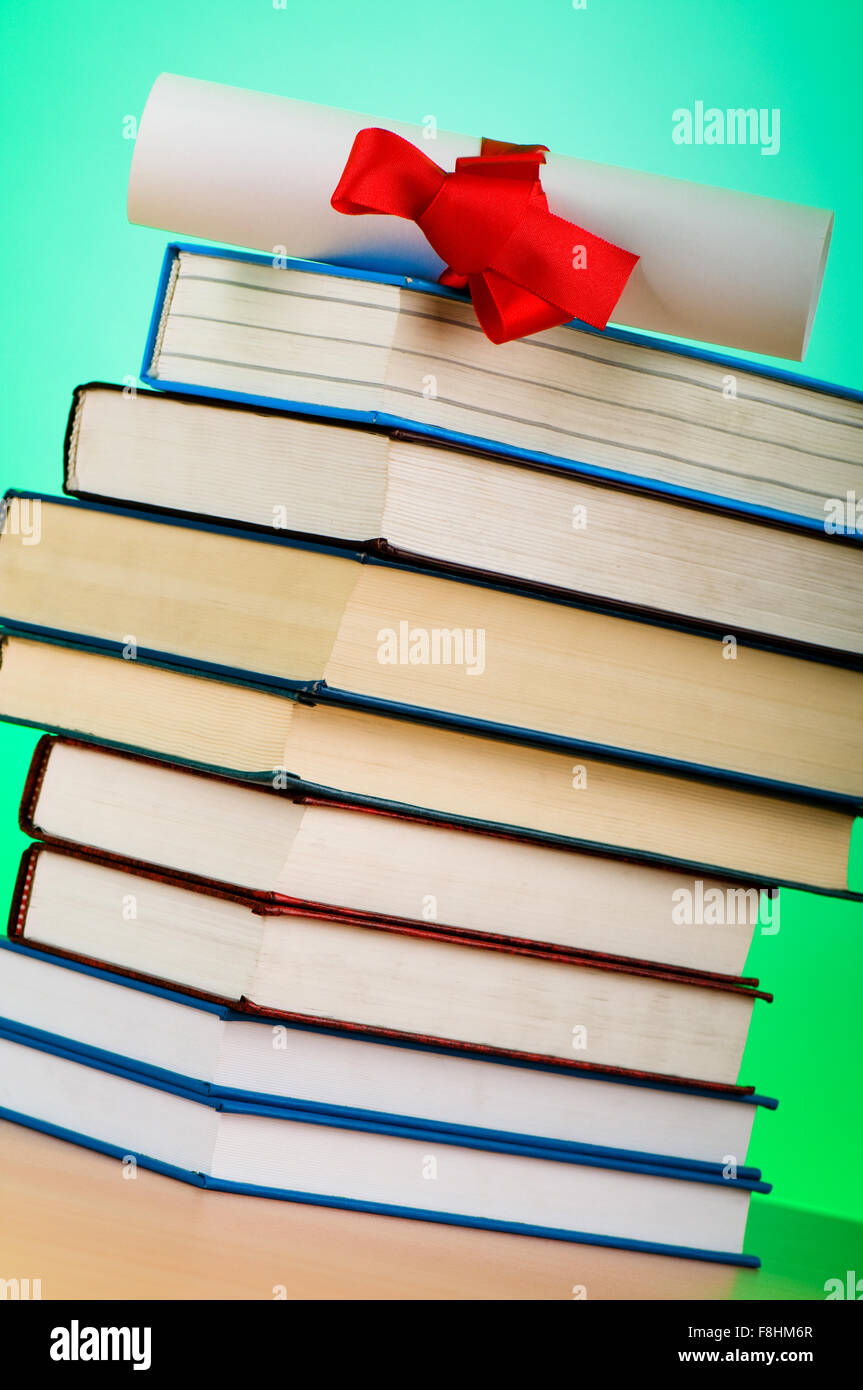 Diploma and stack of books against the background Stock Photo - Alamy
