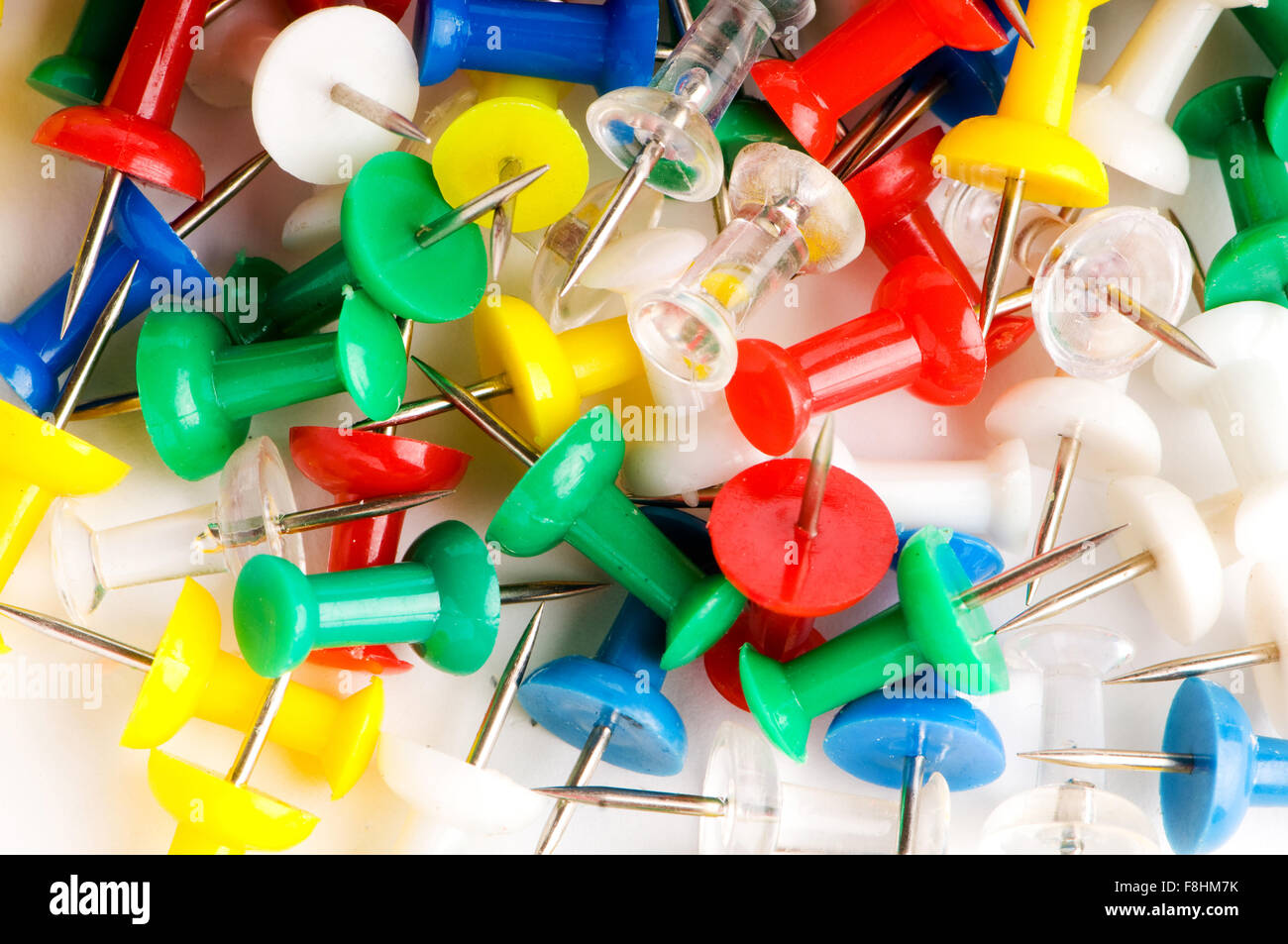 Many colourful office pins on the background Stock Photo - Alamy