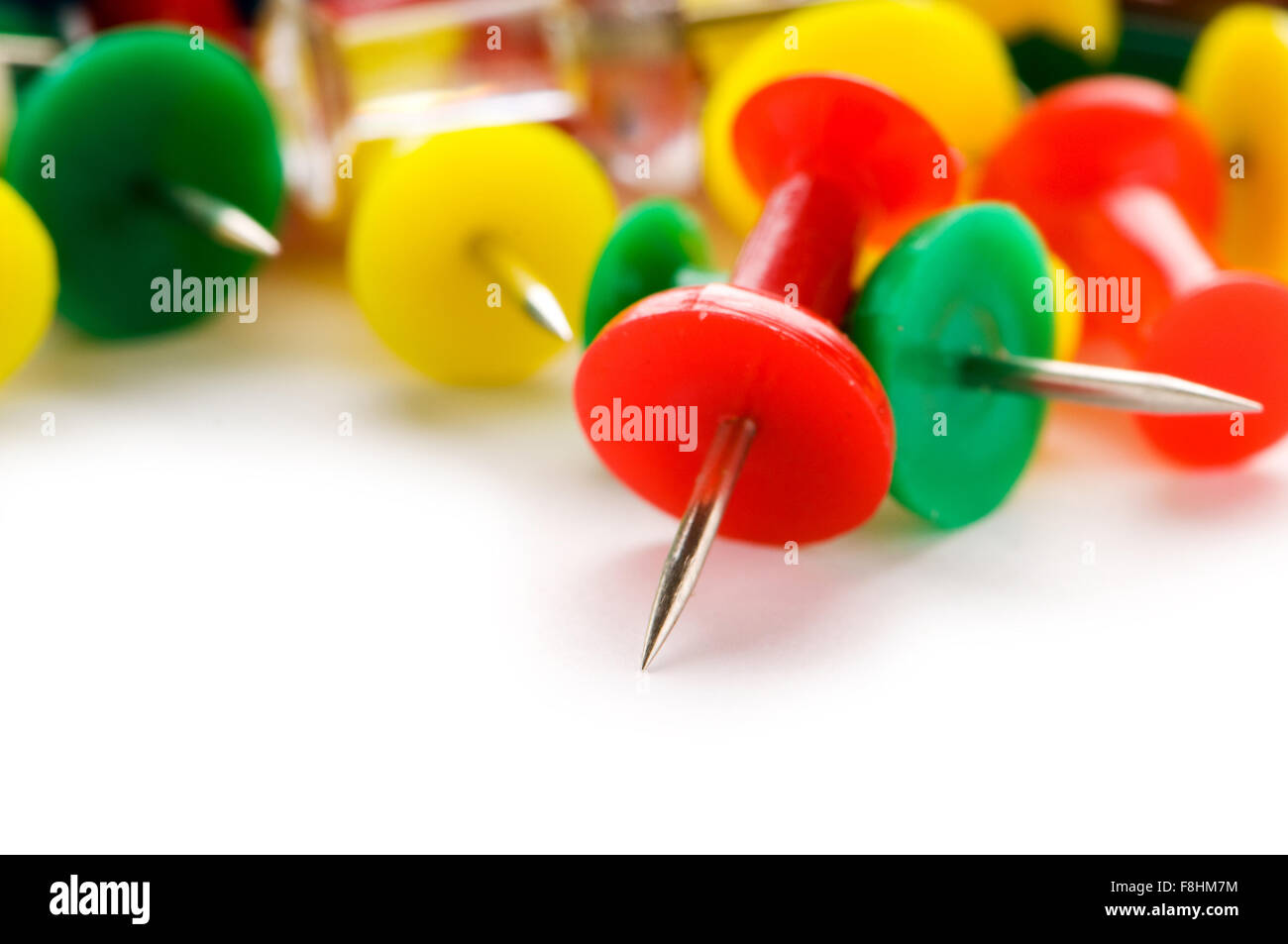 Many colourful office pins on the background Stock Photo - Alamy
