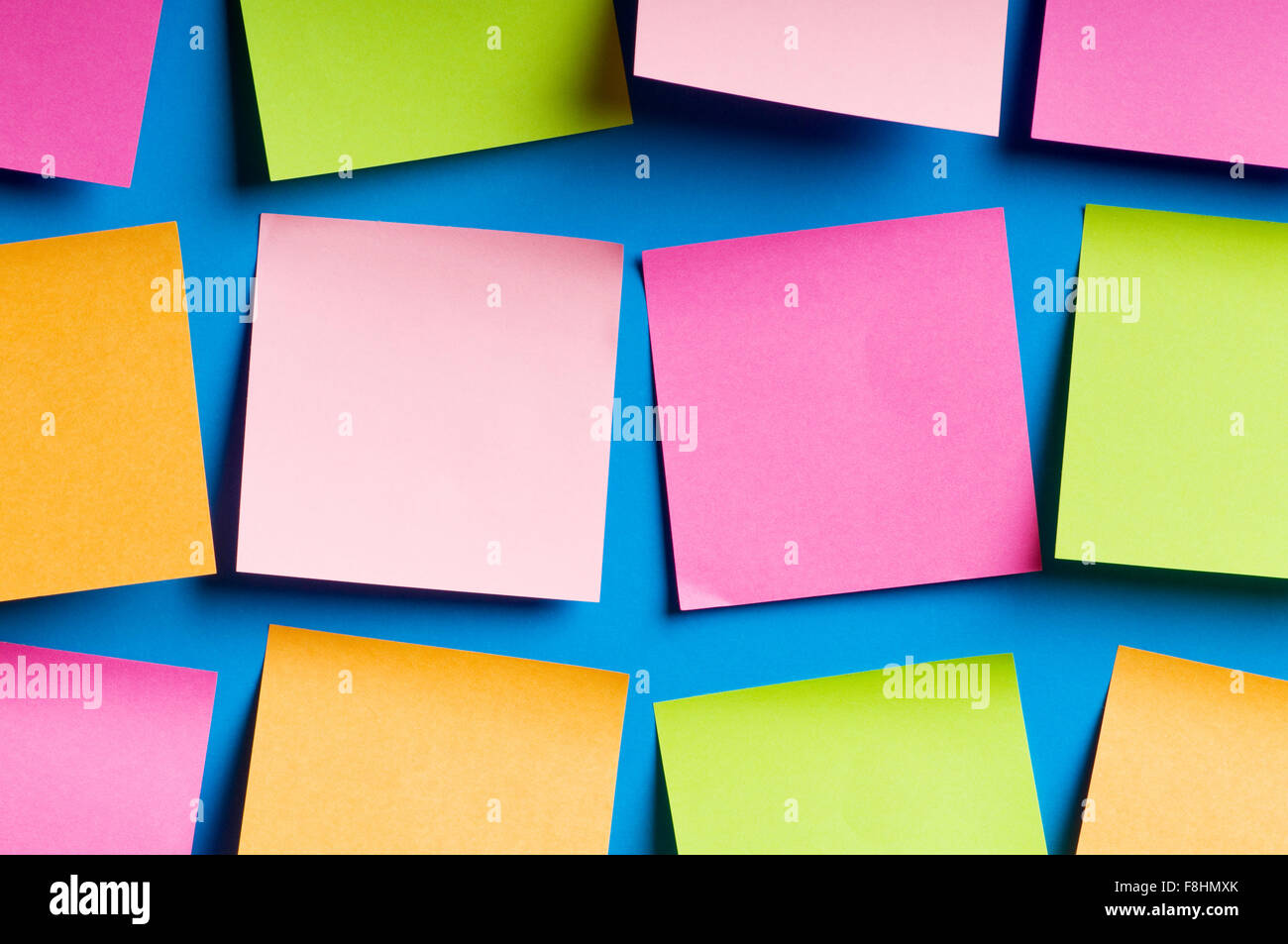 Reminder notes on the bright colorful paper Stock Photo - Alamy