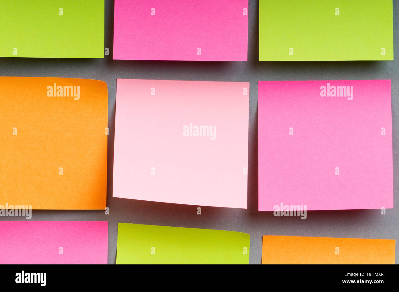 Reminder notes on the bright colorful paper Stock Photo - Alamy