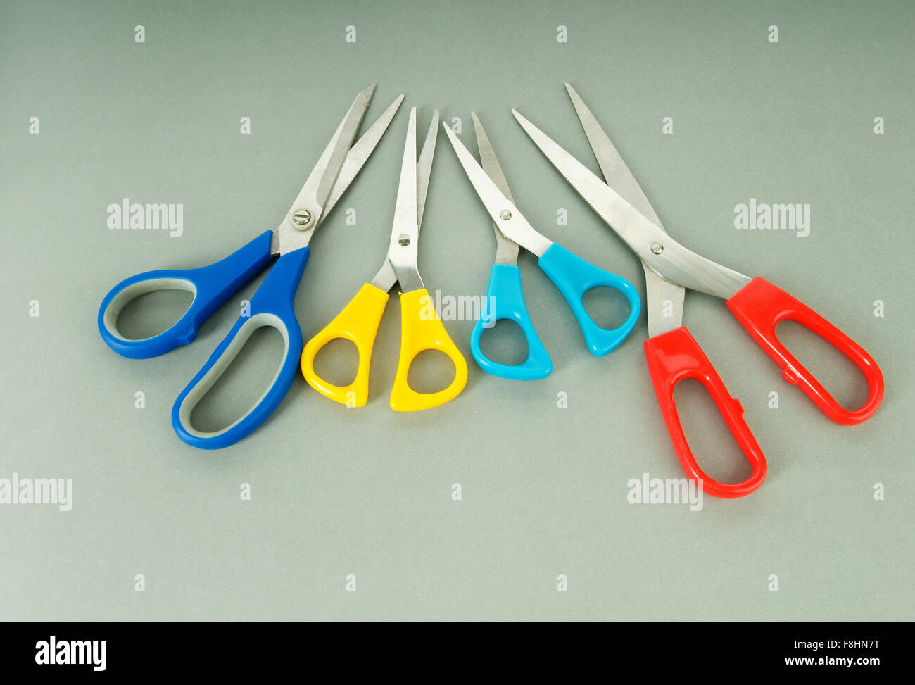 Colorful scissors on the color paper background Stock Photo - Alamy