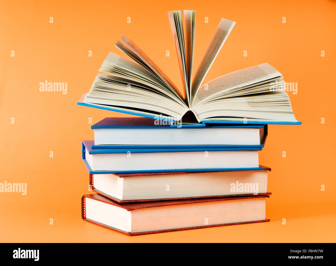 Stack of books on the color background Stock Photo - Alamy