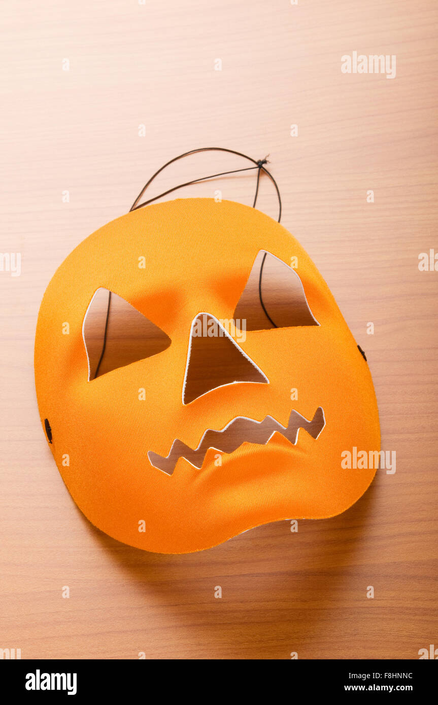 Orange scary halloween mask as holiday concept Stock Photo - Alamy