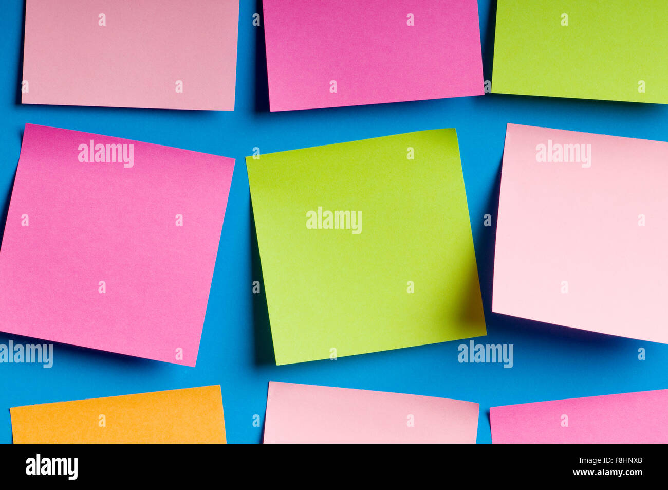 Reminder notes on the bright colorful paper Stock Photo - Alamy
