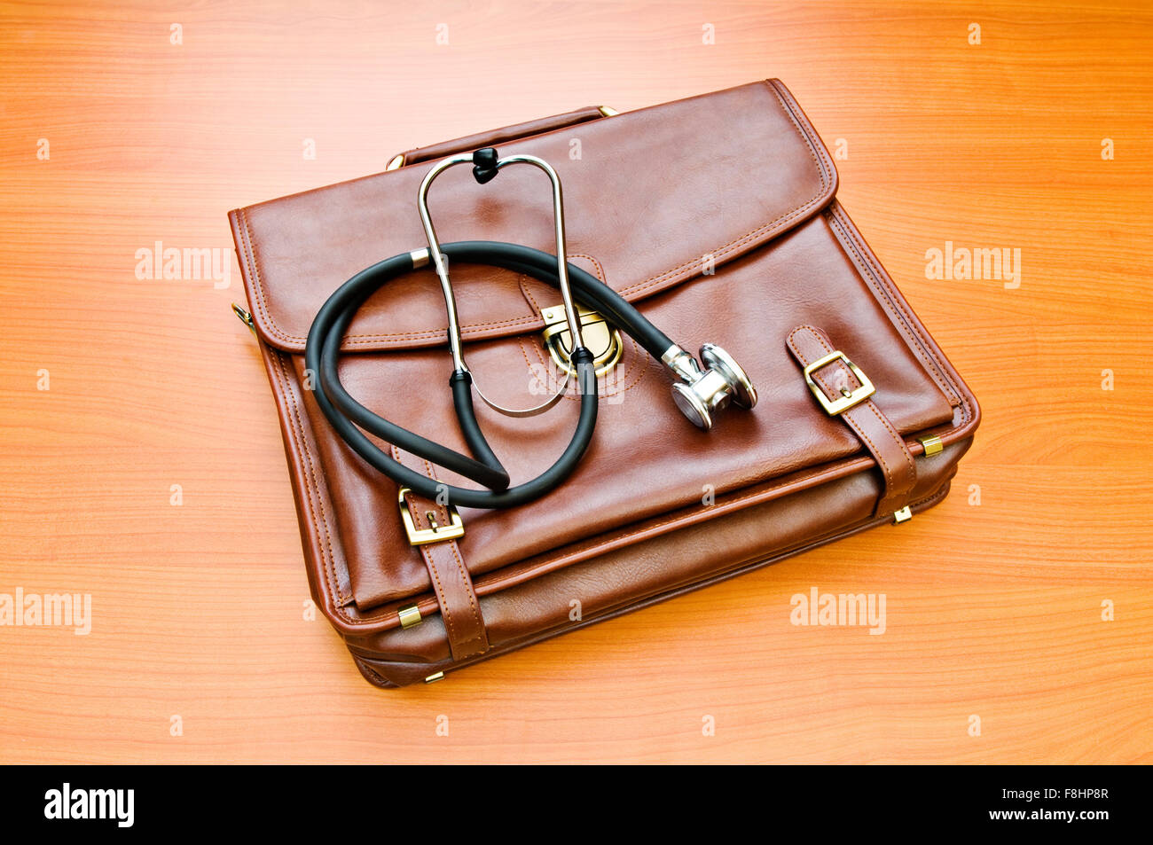 Doctor's case with stethoscope against wooden background Stock Photo ...