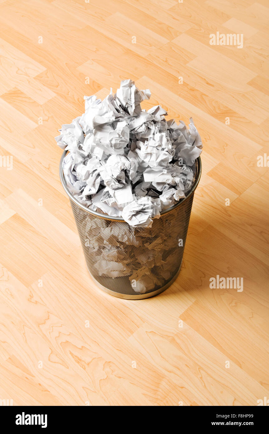 Garbage bin with paper waste isolated on white Stock Photo - Alamy