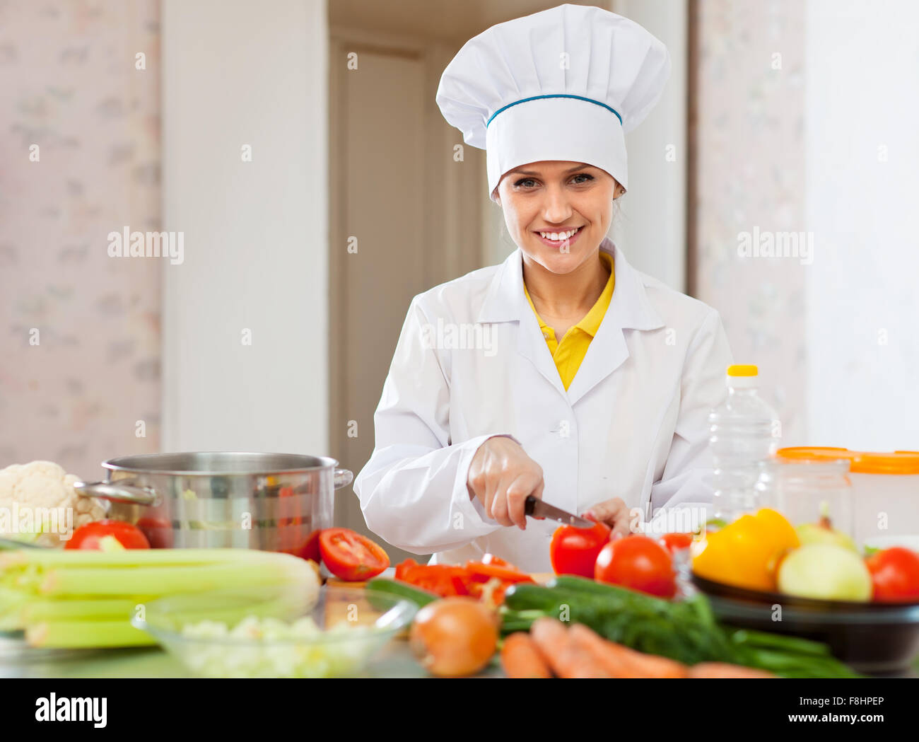 young cook works with vegetables at kitchen Stock Photo - Alamy