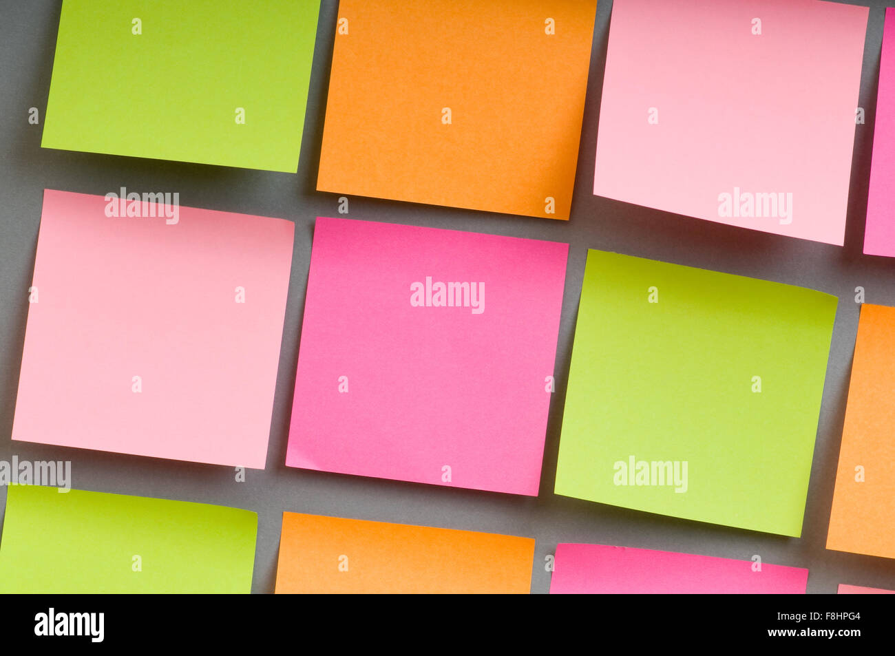 Reminder notes on the bright colorful paper Stock Photo - Alamy