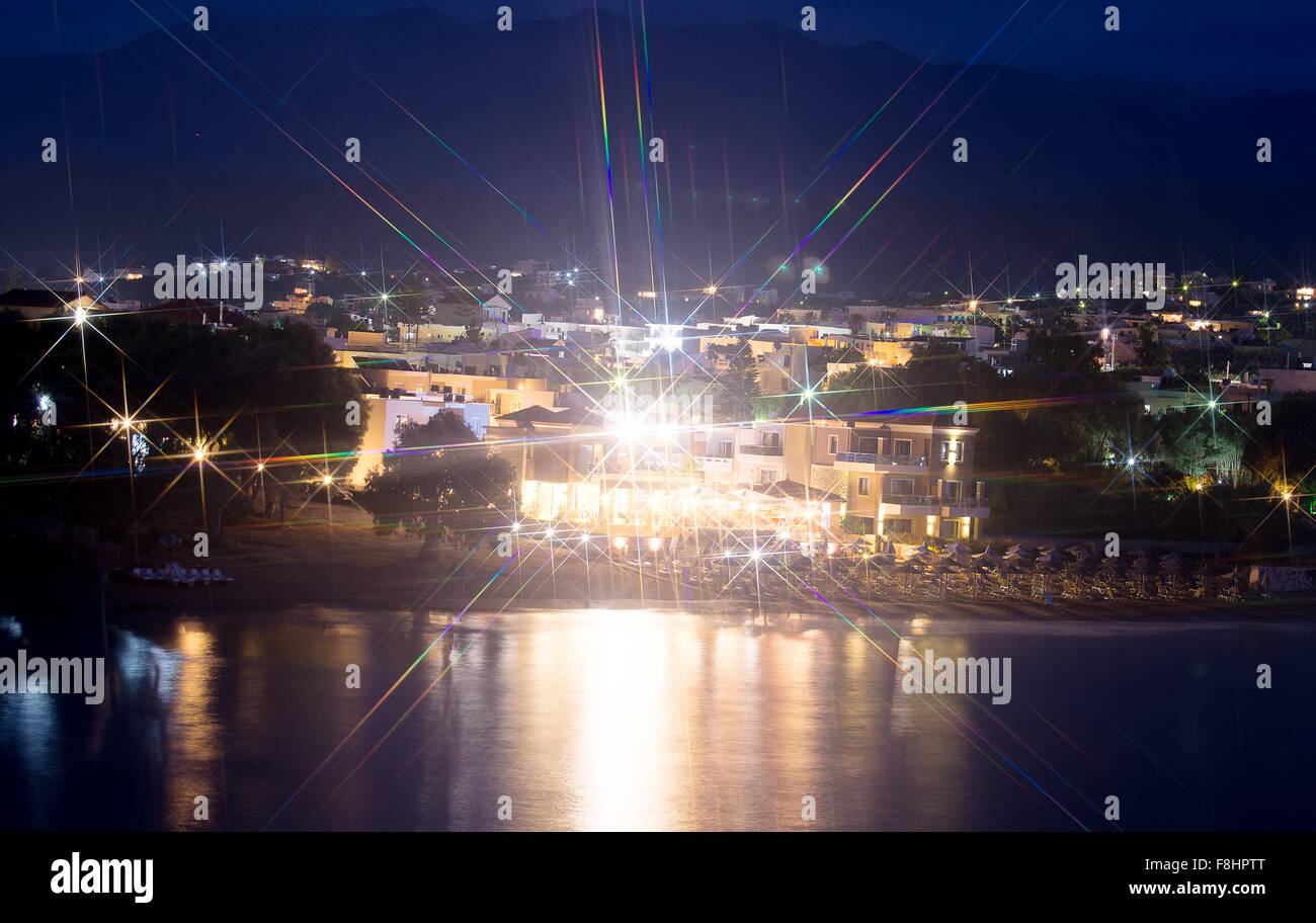 Night view of beach with hotel Stock Photo - Alamy