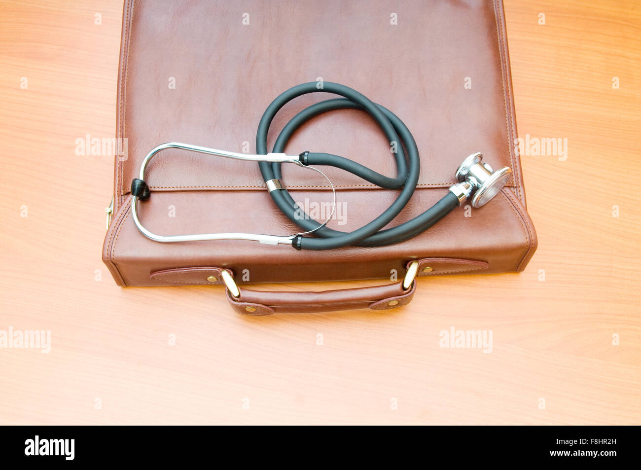 Doctor's case with stethoscope against wooden background Stock Photo ...