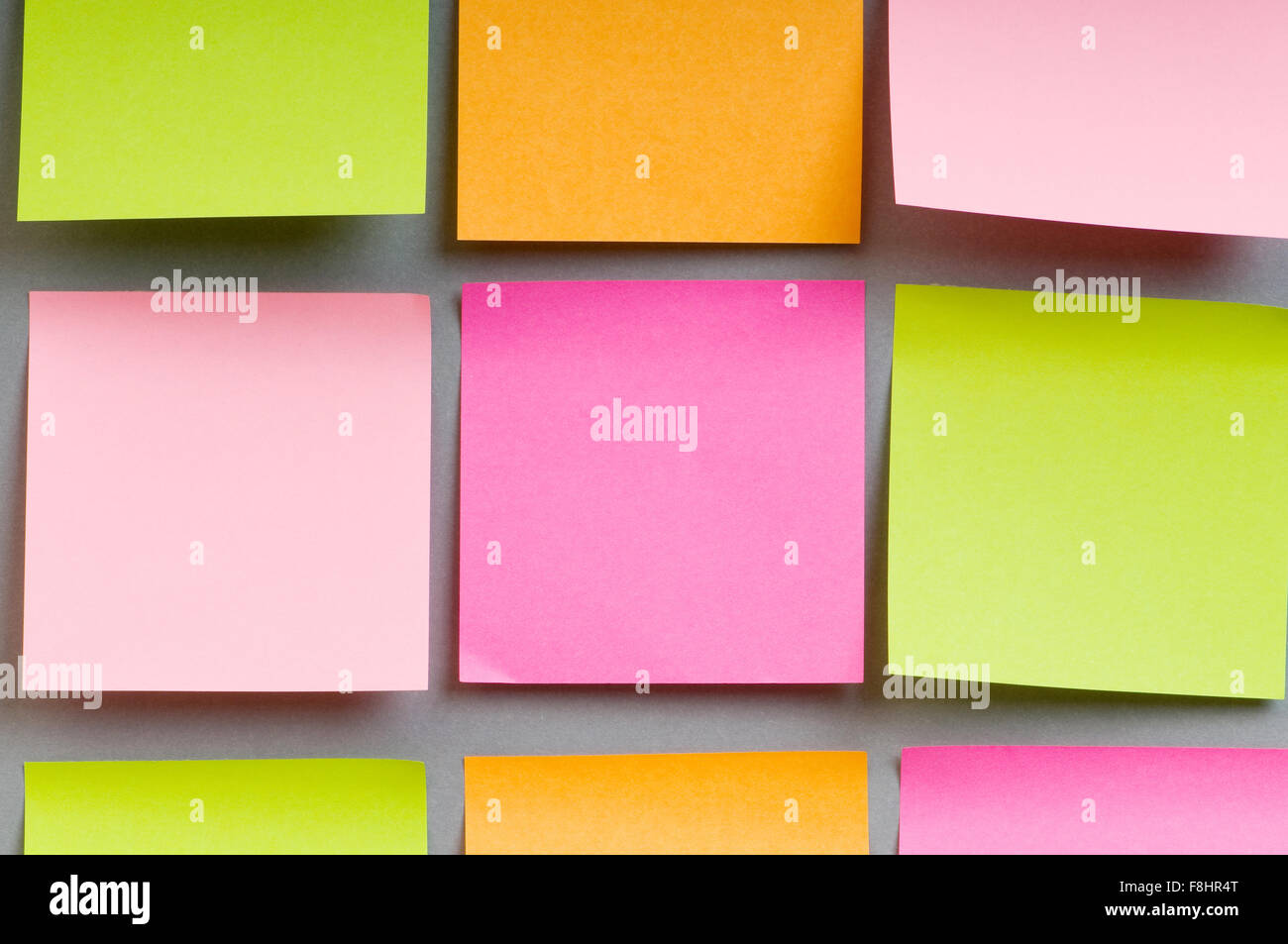 Reminder notes on the bright colorful paper Stock Photo - Alamy