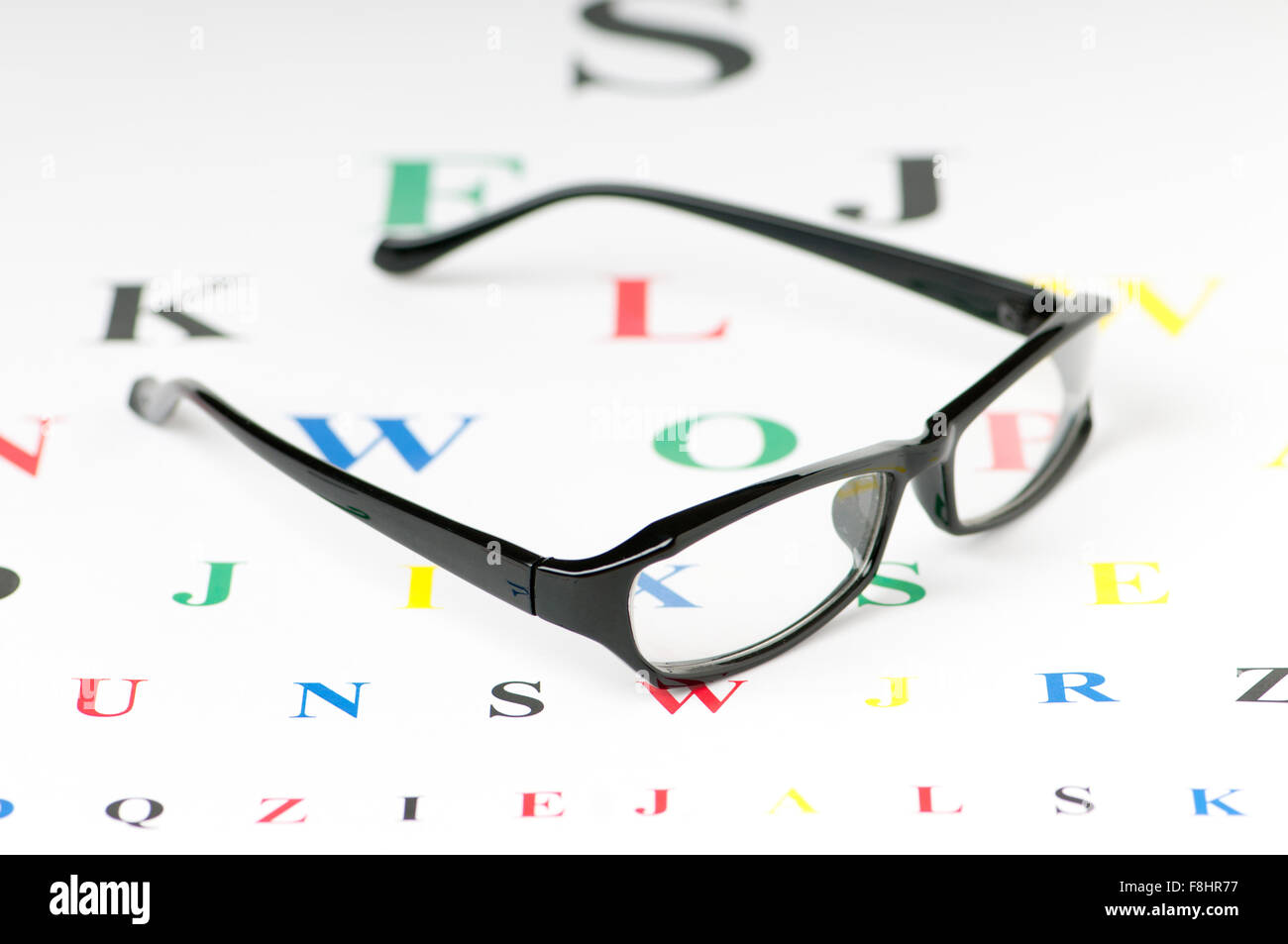 Optical reading glasses on the eyesight table Stock Photo - Alamy