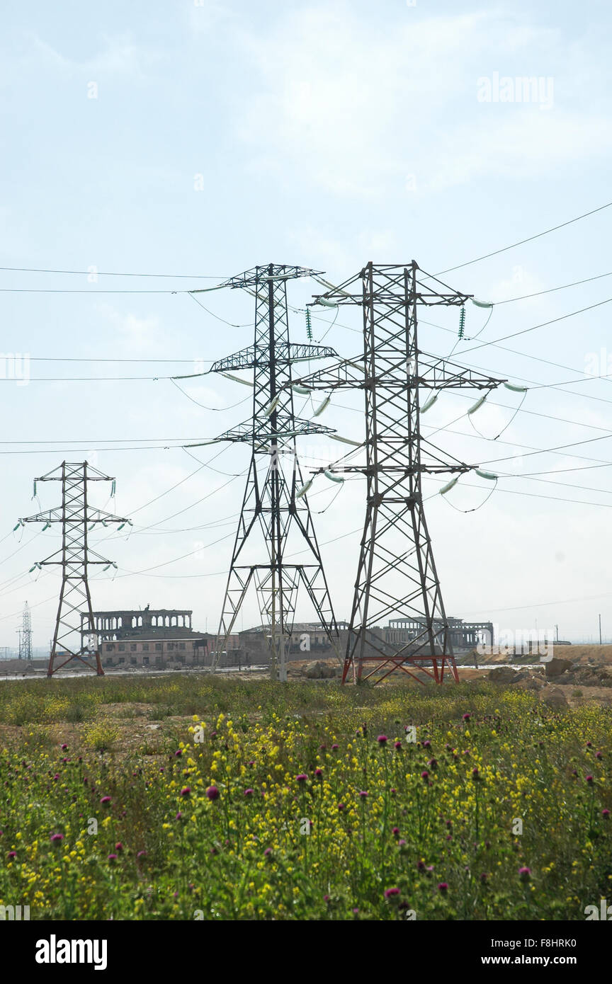 Tall power lines during bright summer day Stock Photo - Alamy