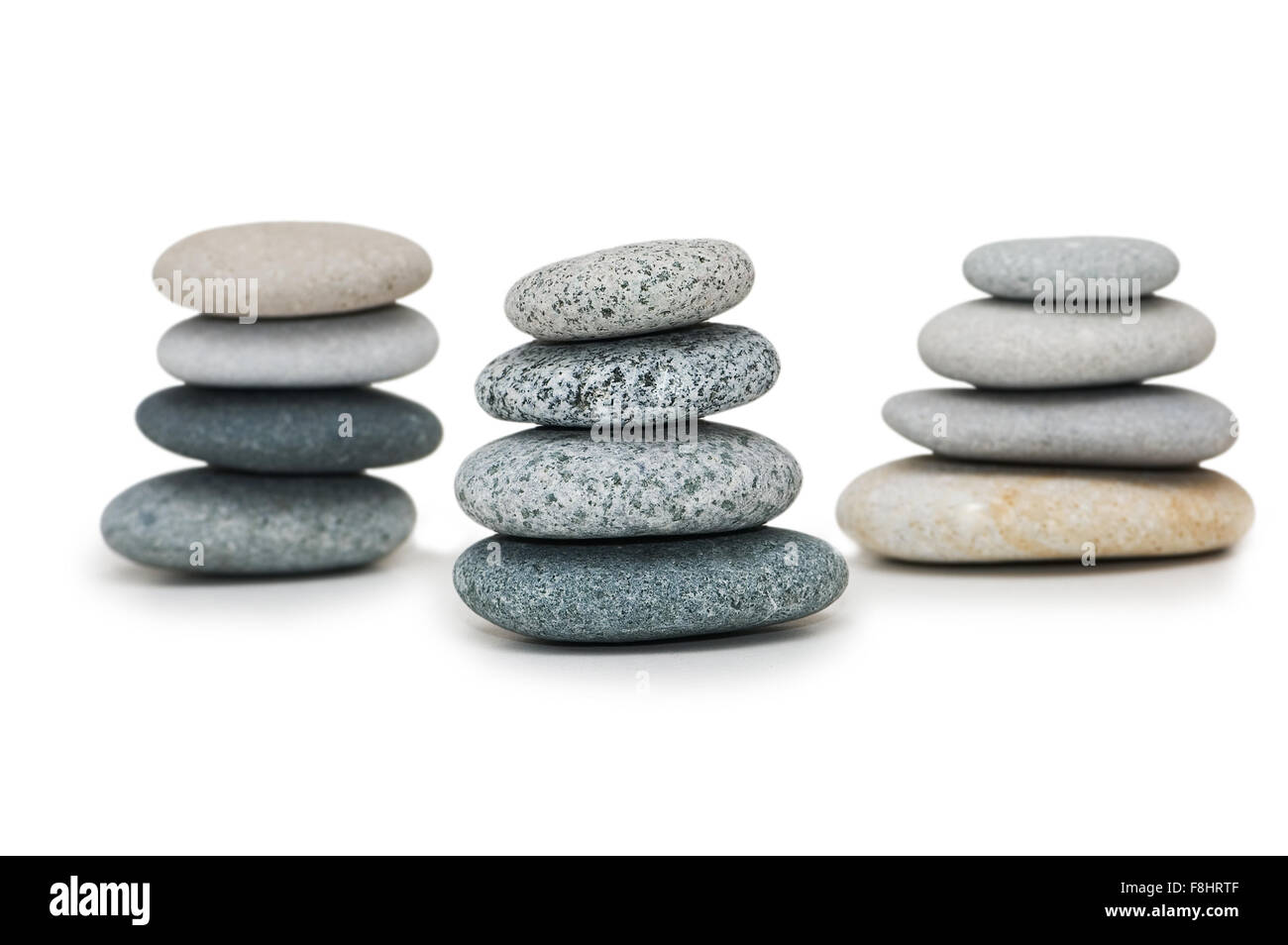 Stack of pebbles isolated on the white Stock Photo - Alamy
