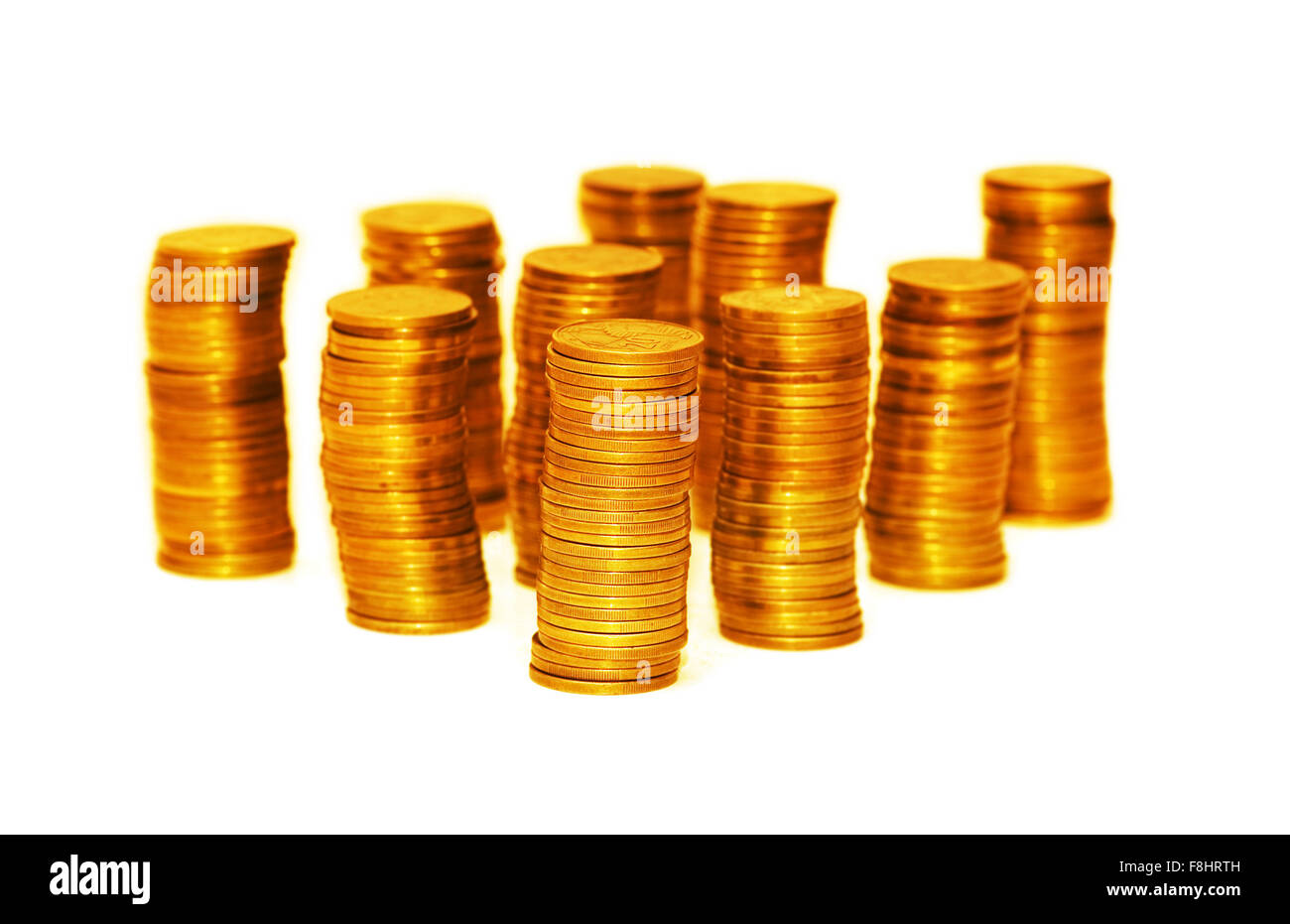 Stacks of gold coins isolated on the white Stock Photo - Alamy