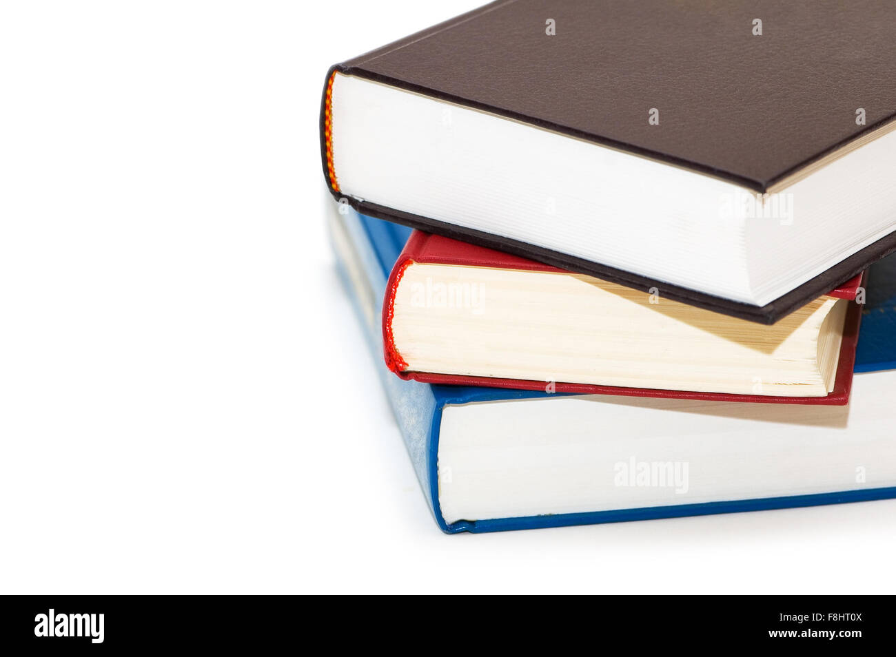 Three colourful books isolated on the white Stock Photo - Alamy