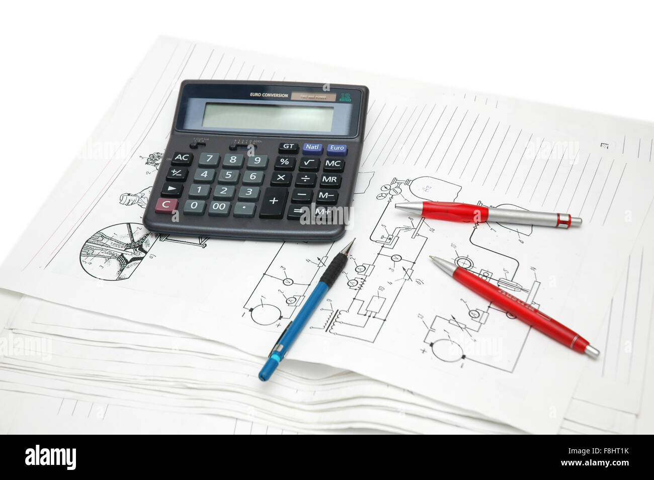 Design drawings, calculator and red pens Stock Photo - Alamy