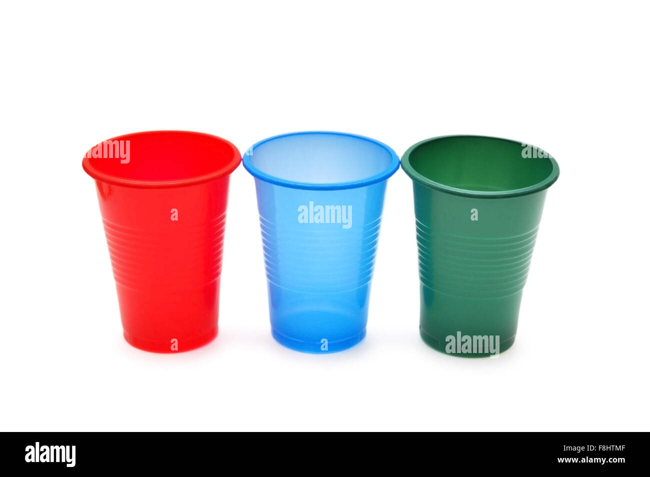 Three plastic cups isolated on the white Stock Photo - Alamy