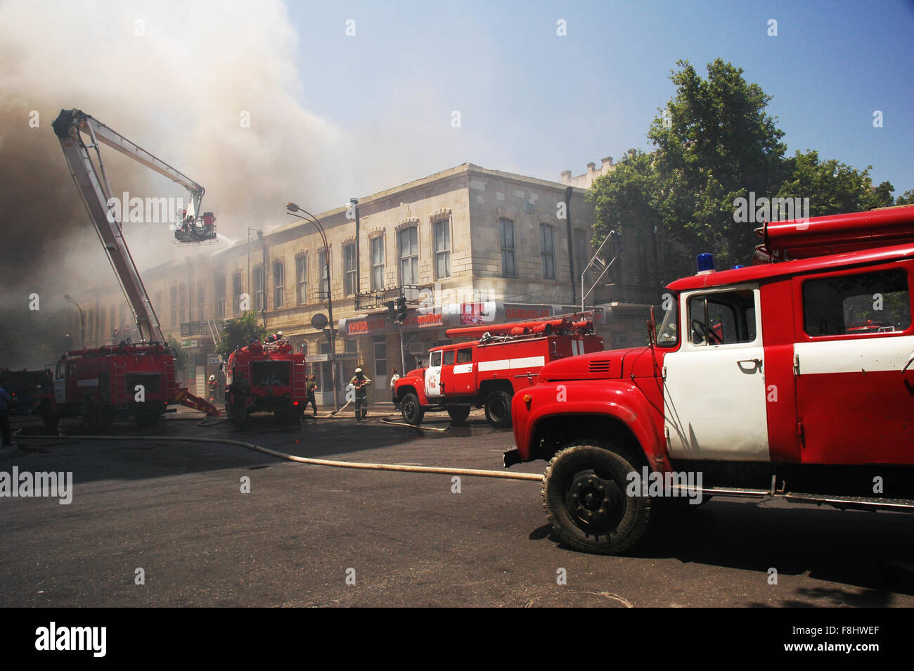 Fire engines at the scene of city fire Stock Photo - Alamy