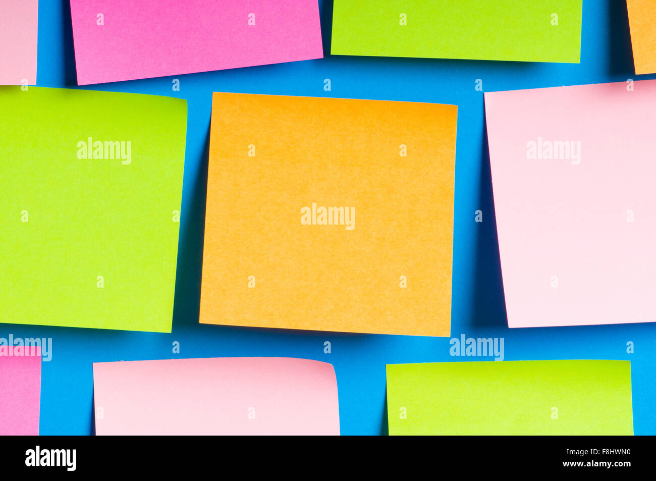 Reminder notes on the bright colorful paper Stock Photo - Alamy