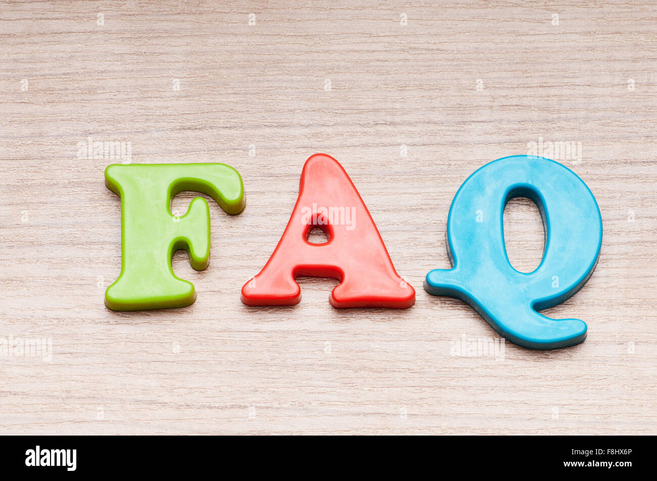 FAQ word on the background Stock Photo - Alamy