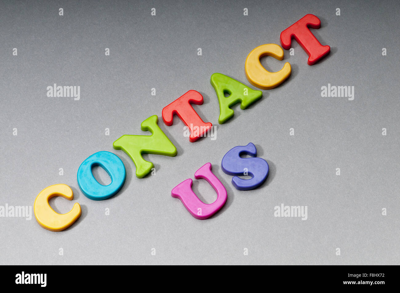 Contact us concept with letters on background Stock Photo - Alamy