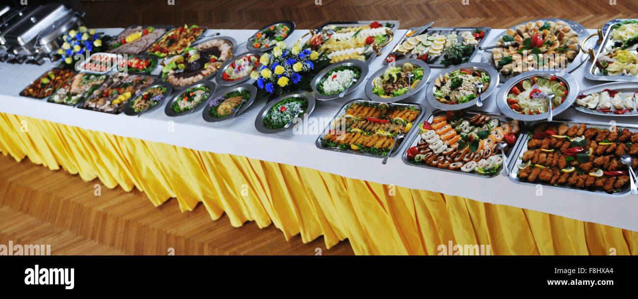 buffet catering food arangement on table Stock Photo - Alamy
