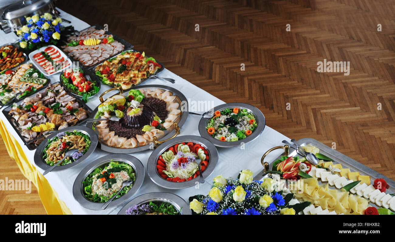 buffet catering food arangement on table Stock Photo - Alamy