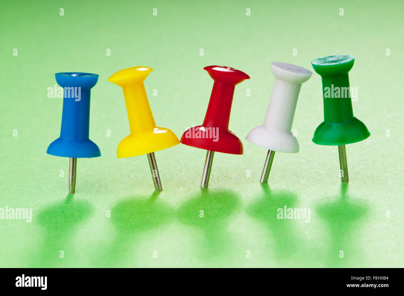 Office pins on the paper Stock Photo - Alamy